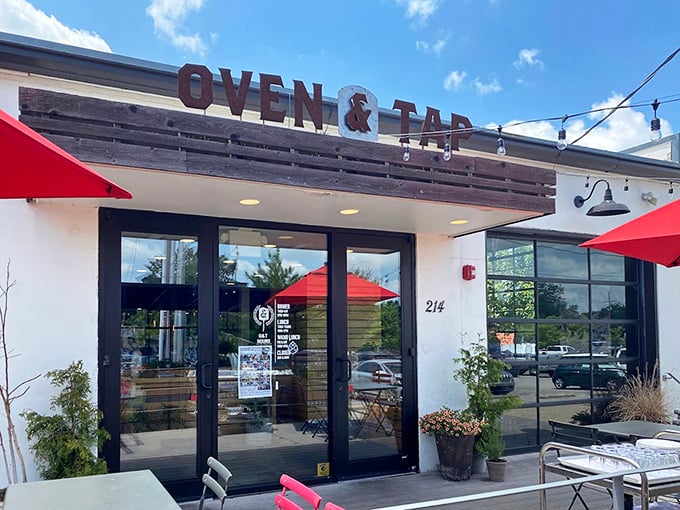 Oven & Tap's clean lines and modern signage hint at the contemporary pizza masterpieces waiting just beyond those glass doors.