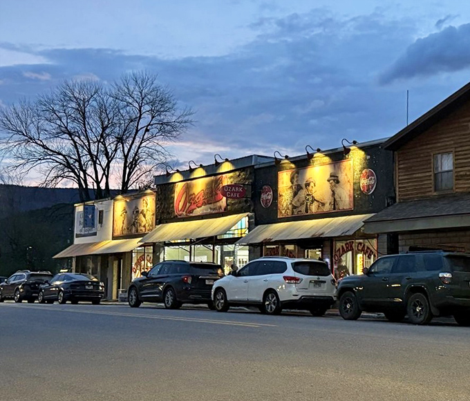 Ozark Cafe's storefront glows with promise as evening falls &ndash; a mountain town's beating culinary heart.