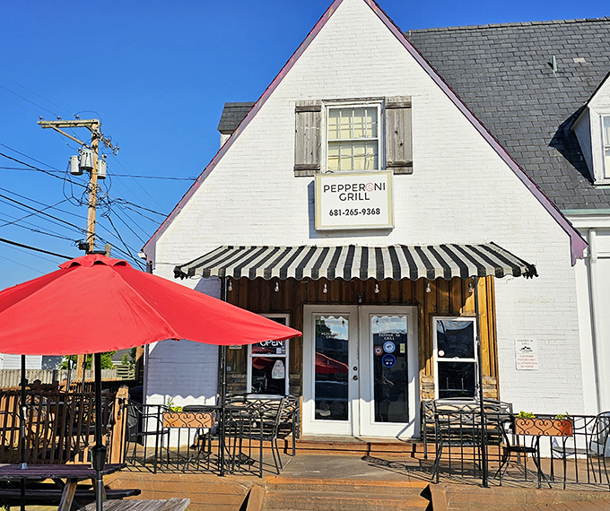 Pepperoni Grill's storybook cottage design makes pizza feel like a special occasion. That red umbrella is practically winking at you!