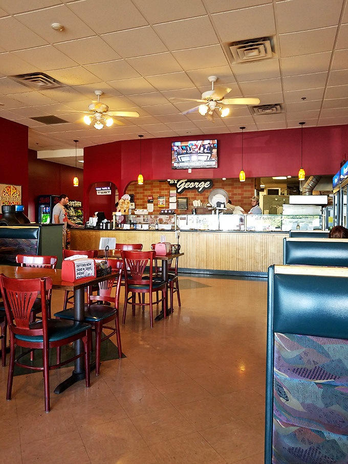 Pizza by George's interior isn't just a restaurant&mdash;it's a warm hug in food form, where every table feels like the best seat in the house.