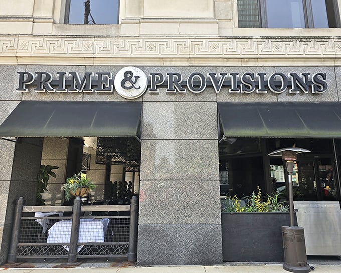 That elegant stone facade in the Loop whispers sophistication before you even taste their dry-aged prime cuts inside.