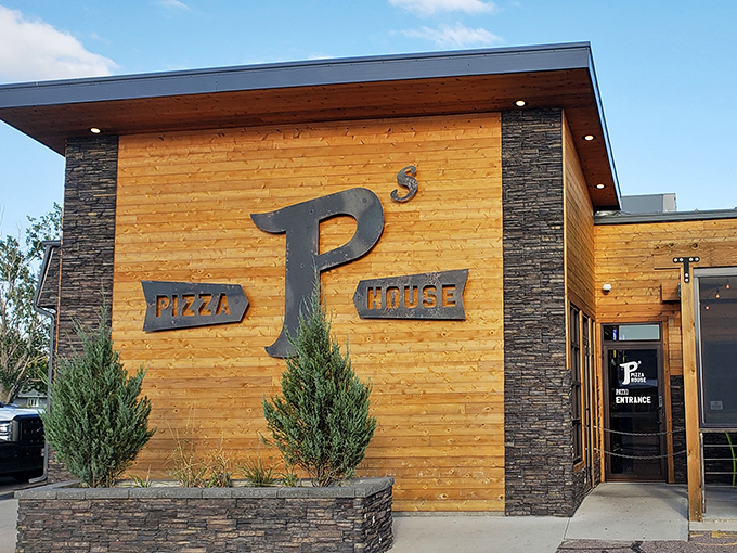 P's Pizza House's modern wooden facade brings contemporary style to traditional pizza-making. Rustic meets refined in both building and pizza.