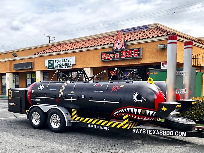 That distinctive smoker trailer suggests serious barbecue dedication and authentic flavors crafted with genuine passion.