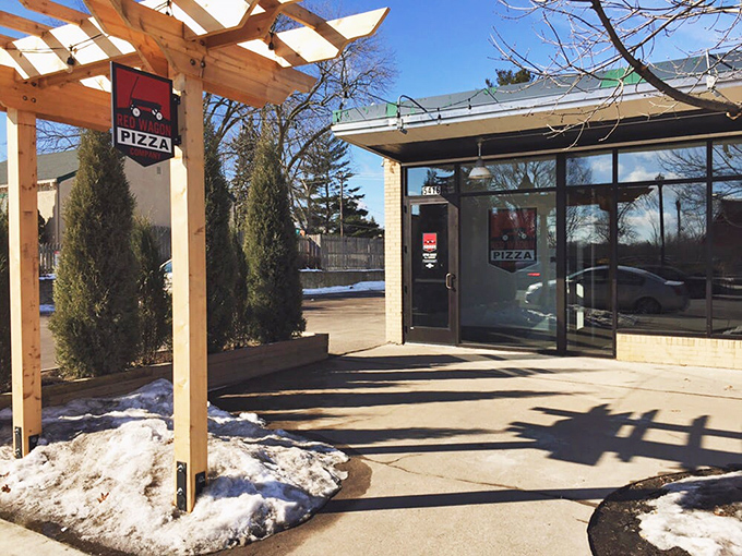 Red Wagon's charming outdoor patio, with trees growing right through it, creates the perfect pizza garden experience.