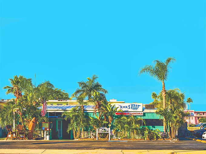 Rick's Reef looks like it was built from driftwood dreams and beach memories. Palm trees frame this laid-back seafood haven.