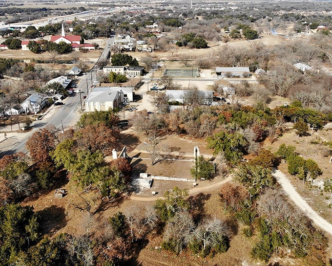 Historic aerial view of limestone buildings line streets where artists and craftspeople keep traditional skills alive and thriving beautifully.