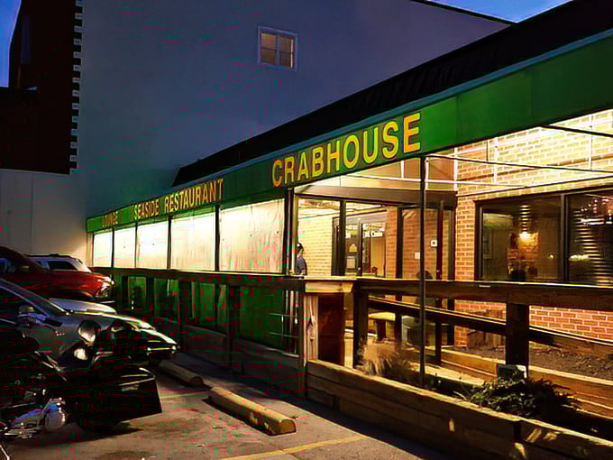 Seaside Restaurant's green awning glows like a seafood lighthouse in the night. Simple outside, spectacular flavors inside.