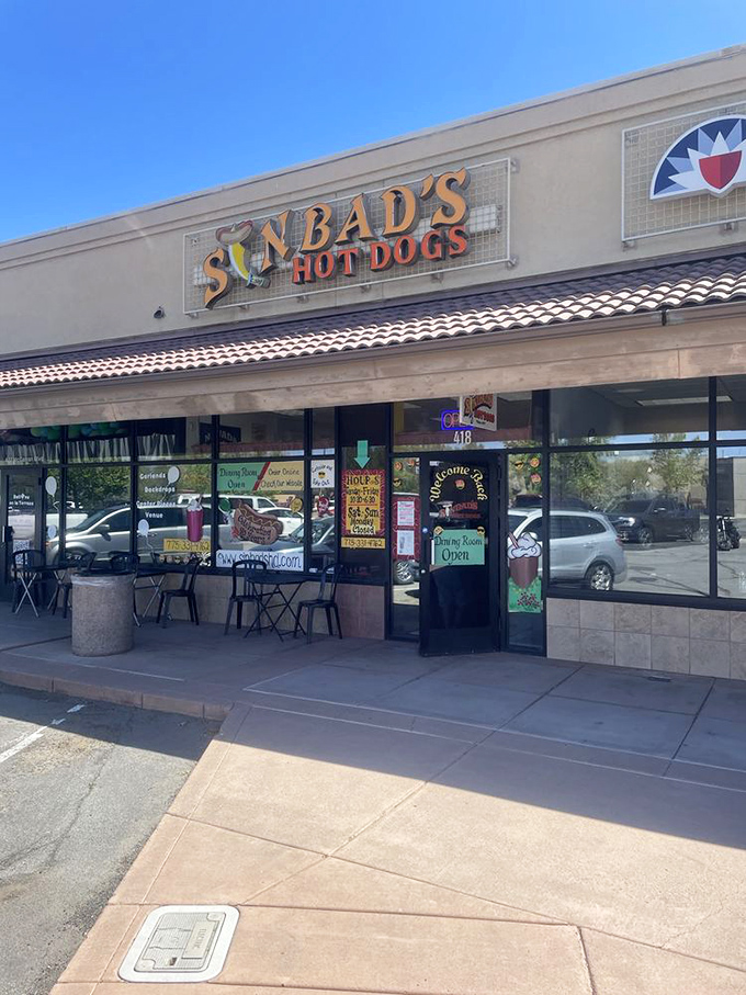 Sinbad's colorful storefront promises hot dog adventures worthy of its namesake sailor. No seven seas required—just seven toppings!