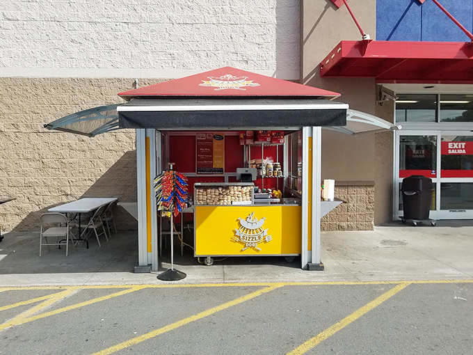 Sizzle Dogs' humble yellow kiosk proves great hot dogs don't need fancy digs – just quality ingredients and perfect grilling.