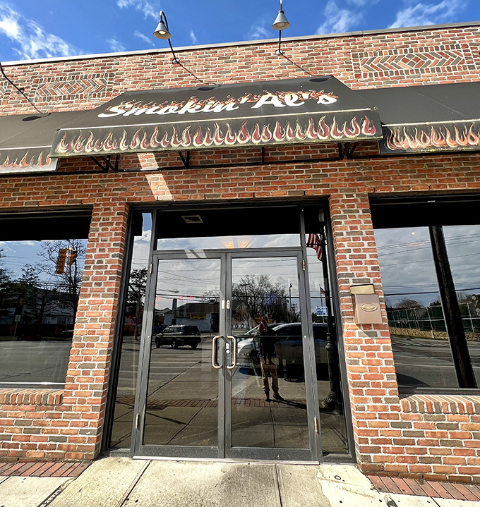 Flames on the awning forecast flavor explosions inside! Smokin' Al's brick fortress houses tender treasures that would make even the most dedicated vegetarian question their life choices.