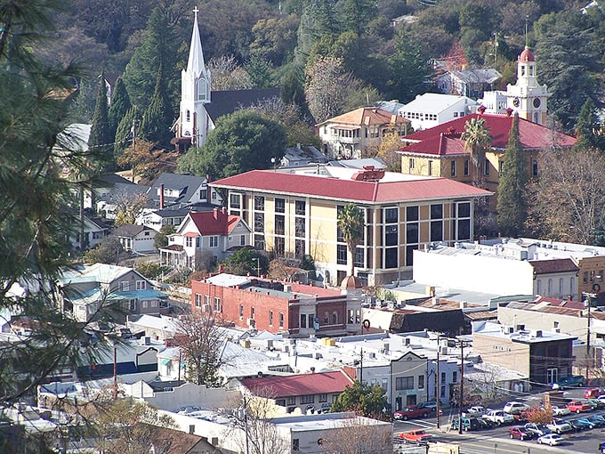 Sonora's historic skyline tells stories of Gold Rush dreams, where church steeples and red rooftops create a postcard-perfect mountain town.