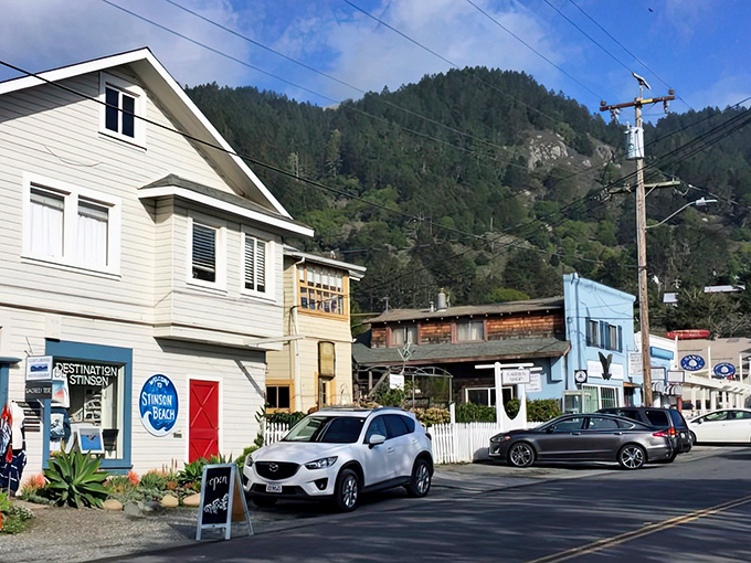 Stinson Beach's colorful storefronts nestle against mountain backdrops, proving that Mother Nature and small businesses make perfect neighbors.