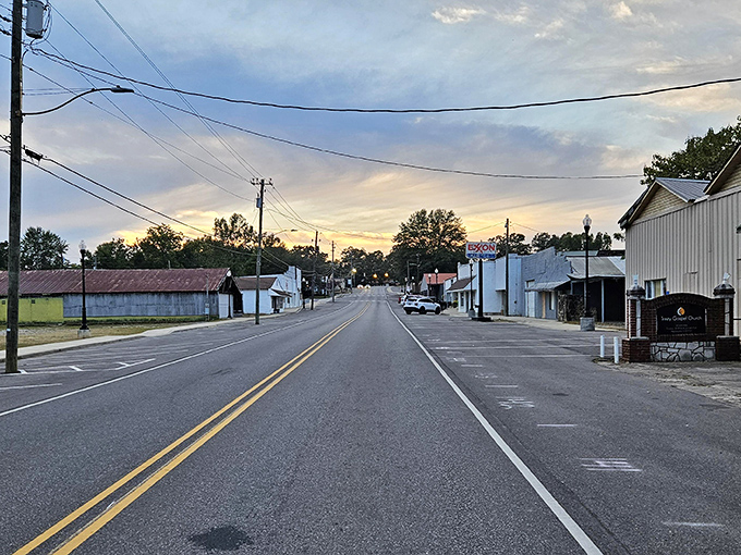The sun sets over Sumiton's modest skyline, painting a masterpiece that costs nothing to enjoy from your reasonably-priced front porch.