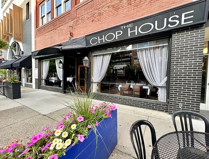 The Chop House Ann Arbor brings a touch of elegance to Main Street with its classic storefront and inviting window displays.