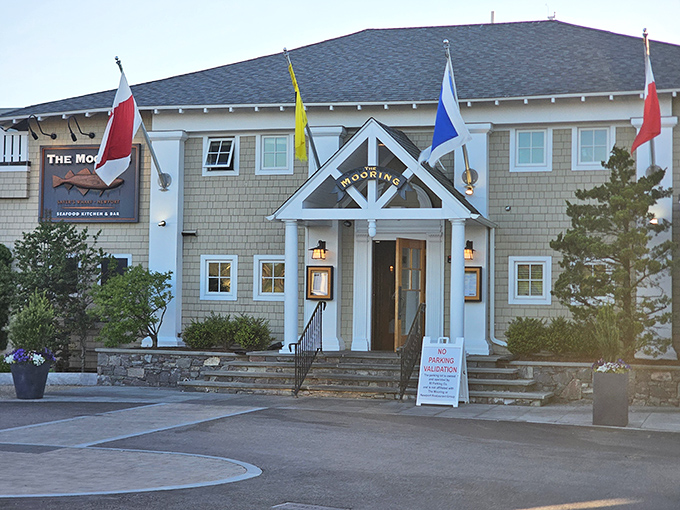 International flags flutter in the ocean breeze, welcoming seafood lovers to this harbor-side haven of culinary delights.