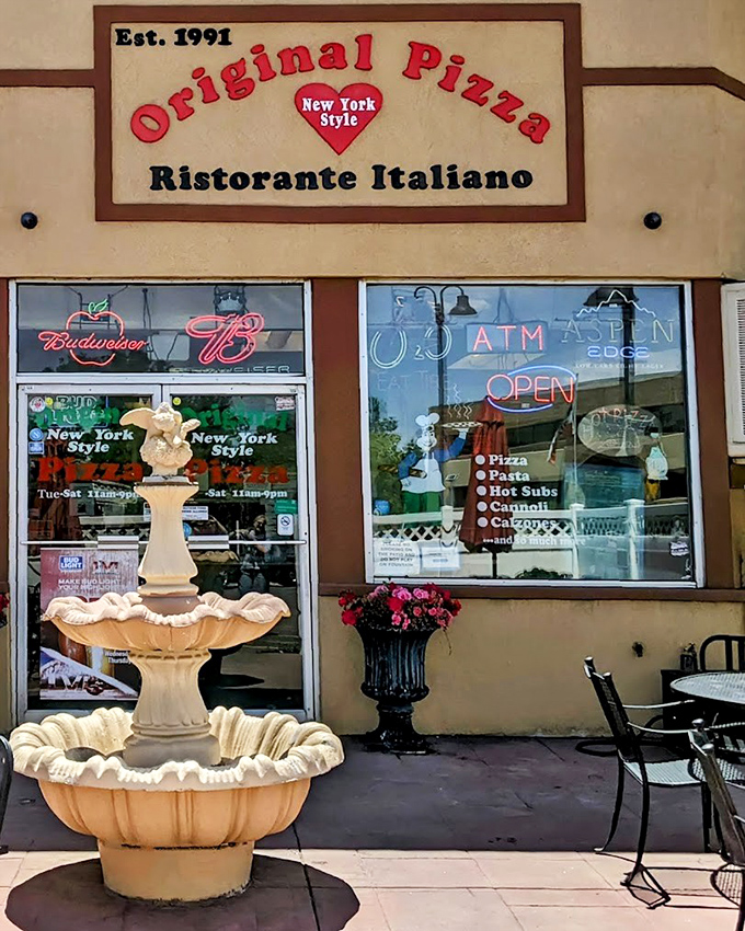 That "Original Pizza" sign with the little red heart says it all – New York pizza love in the heart of Colorado.