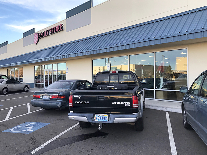 Salvation for shoppers! The Family Store's blue awning shelters windows full of potential treasures, just waiting for eagle-eyed bargain hunters.