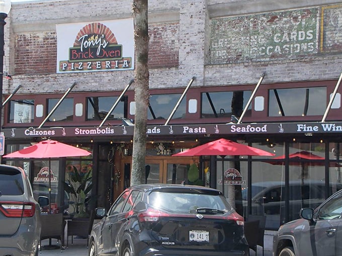 Tony's Brick Oven Pizzeria's vintage storefront oozes old-world charm. Those red umbrellas practically whisper "sit and stay awhile"!