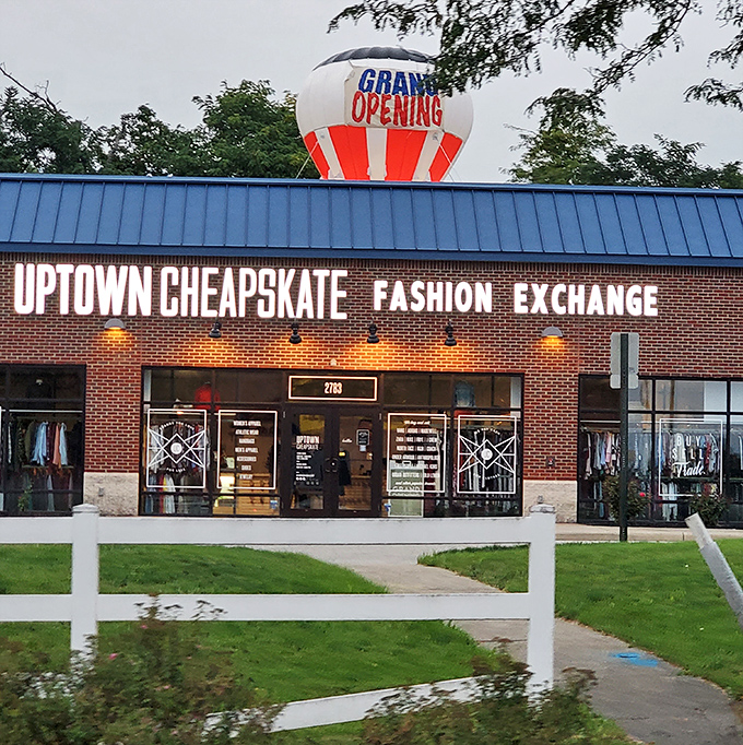 Uptown Cheapskate's grand opening balloon announces its arrival like a fashion festival. Blue roof, brick facade, and style for days.