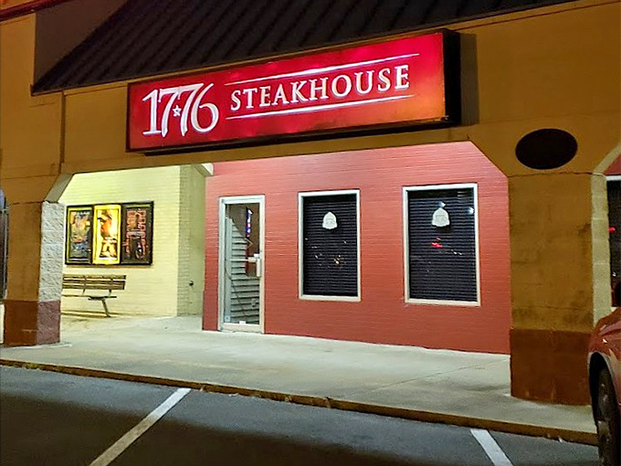 By night, 1776's glowing red sign serves as a patriotic beacon for those pledging allegiance to perfectly cooked beef.