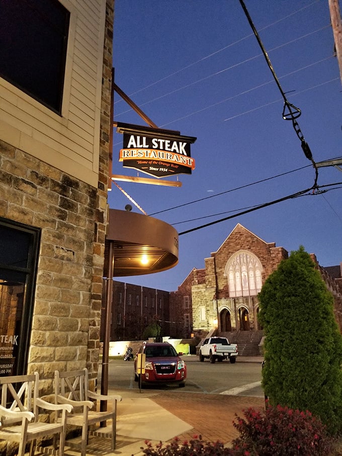 History and flavor converge at All Steak's corner location. That sign promises exactly what you're craving.