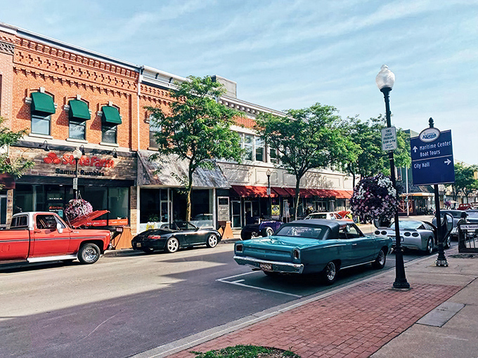 Classic cars cruise downtown Alpena during a summer show, proving this town knows how to entertain without expensive admission.