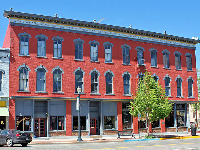 The vibrant red buildings of Ca&ntilde;on City pop against the blue sky, much like your savings will pop in this affordable town.