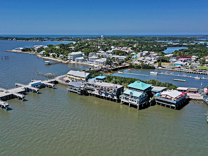 Cedar Key's waterfront buildings seem to float above the Gulf. A postcard-perfect scene that hasn't changed in decades.
