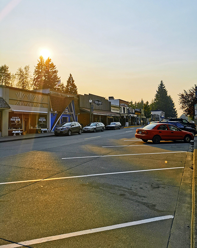 Golden hour transforms Concrete's modest main street into a Norman Rockwell painting where your Social Security check stretches like taffy.