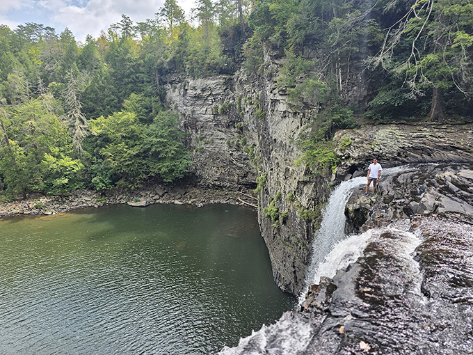 Standing at the edge where water cascades into the emerald pool below gives perspective that no motivational poster ever could.