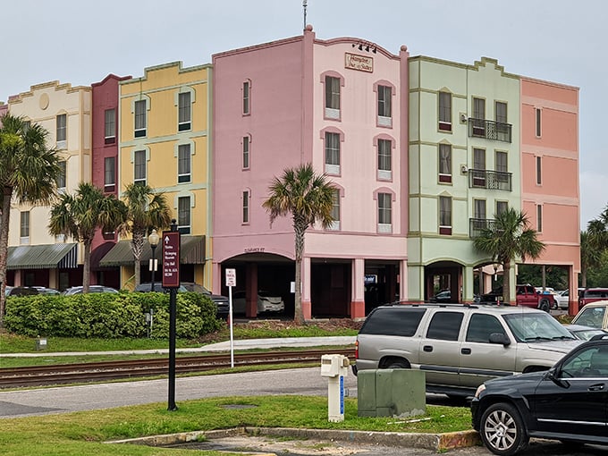 Pastel-colored facades and swaying palm trees that make you wonder if you took a wrong turn and ended up in a Caribbean-meets-European resort town.