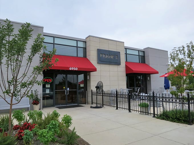 Frank's sleek exterior and elegant columns hint at the upscale pizza experience waiting inside.