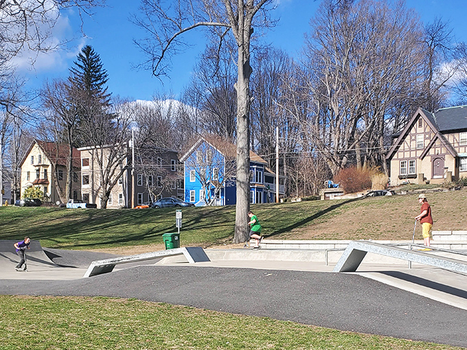 The colorful homes surrounding Gardner's community spaces showcase affordable living options with small-town New England charm.