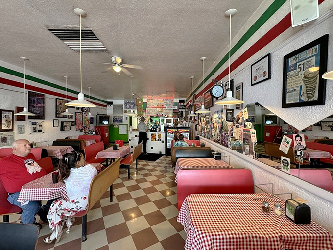 Decades of pizza perfection line the walls at Giovanni's. That Italian flag trim isn't just decoration&mdash;it's a flavor promise.