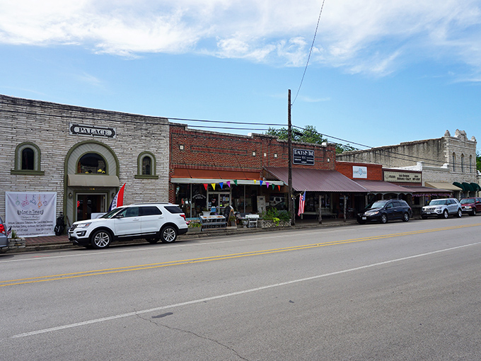 This quiet street scene captures the peaceful rhythm of small-town life where everyone knows your name.