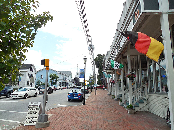 German flags flutter outside local shops in Hillsborough, where international flavor meets small-town New Hampshire affordability.
