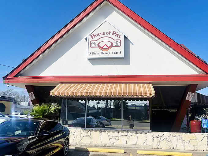 The peaked roof of House of Pies stands like a temple to dessert devotion, where pie crust prayers are answered 24/7.