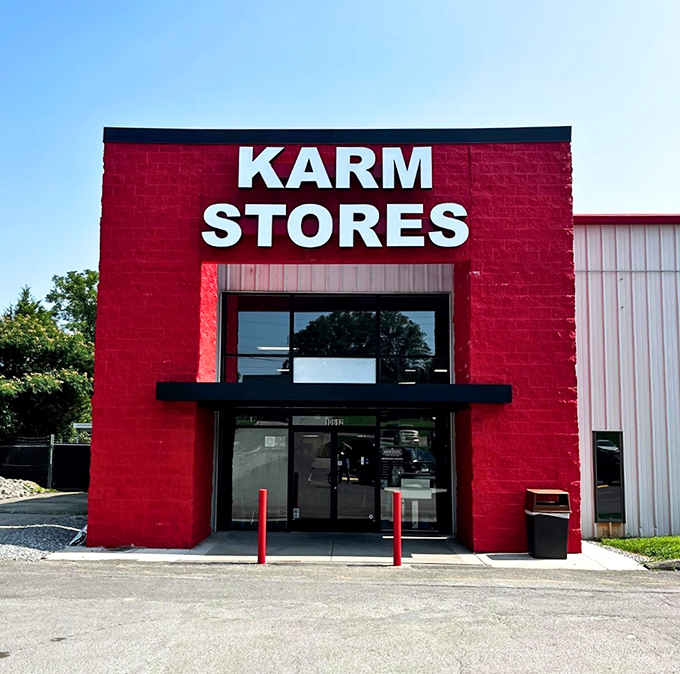 The bold red entrance of KARM Stores welcomes shoppers into a world where purchases help Knoxville's homeless community.