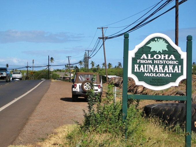 Kaunakakai welcomes you with island pride, its charming sign standing sentinel at the gateway to Molokai's treasured small-town life.