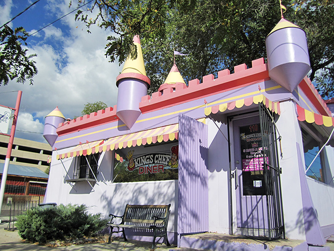 Fairytale architecture meets real-world flavor. Those turrets aren't compensating for anything—the food inside this purple palace truly rules.