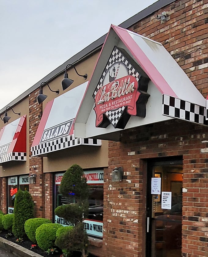 Labella Pizza: Brick building, checkered awning, and the promise of pizza perfection - the holy trinity of neighborhood dining.
