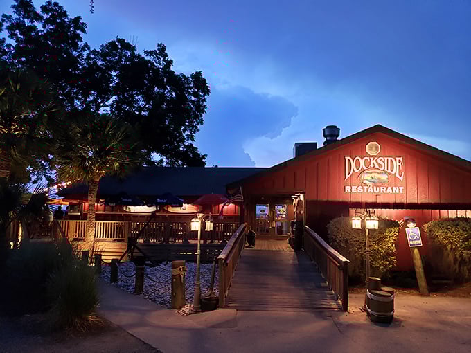 Palm trees and flags welcome you to Dockside's seafood sanctuary. Where Lowcountry views compete with the seafood for your attention—and both win.