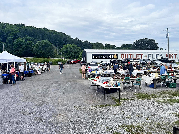 The outdoor market buzzes with weekend energy as shoppers hunt for hidden gems among countless stalls.