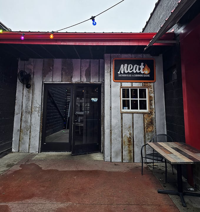As night falls, Meat BBQ's colorful string lights transform this rustic spot into a beacon for those seeking smoky salvation.