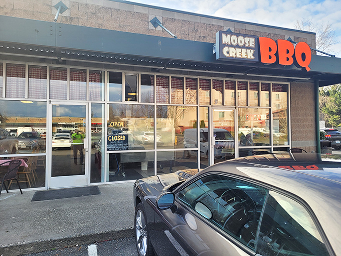 Clear blue skies frame Moose Creek BBQ &ndash; where strip mall simplicity hides smoky, meaty treasures within.