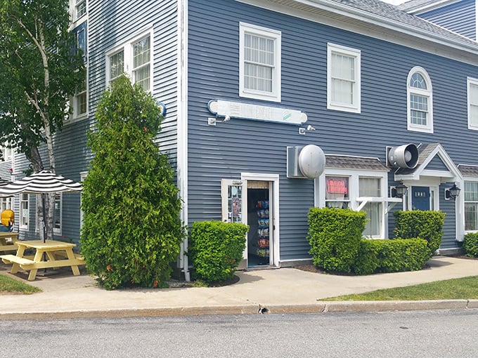 This charming blue building is home to Neon Chicken, where every bite tells a story of perfected family recipes.
