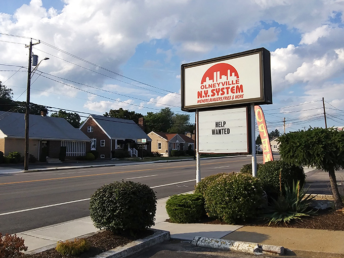 The sign says "Help Wanted," but what you'll really need is extra napkins for these legendary wieners.