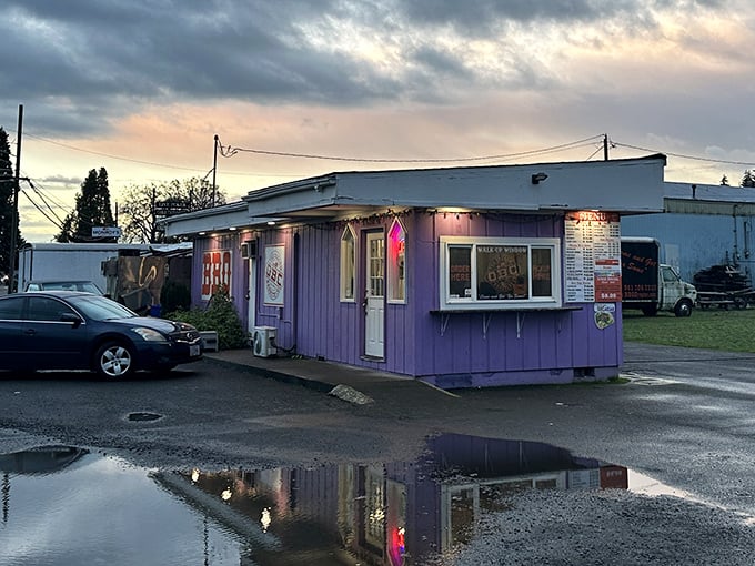 Twilight BBQ magic! As dusk falls, this purple smoke palace glows with the promise of meat treasures within.