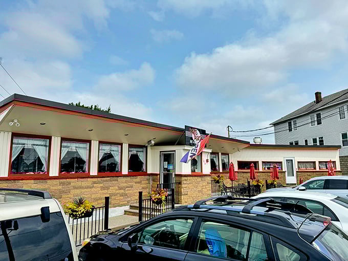 Pazi's stone exterior and bright windows create a welcoming vibe. The "OPEN" flag might as well say "Come home to comfort food."