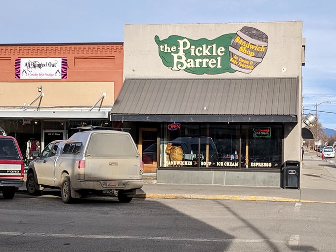 That little green awning marks the spot where sandwich dreams come true - just follow the pickle to flavor town!